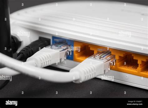 Connect An Ethernet Cable To A Wireless Router On Dark Ethernet Rj45 And Electric Cables