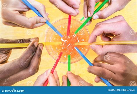 Multiracial Friend Hands Drinking Sex On The Beach Cocktail On B Stock