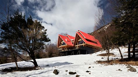 Red Roofs Are Layered Atop Wooden Frame Of Casa Malalcahuello By Gaaa
