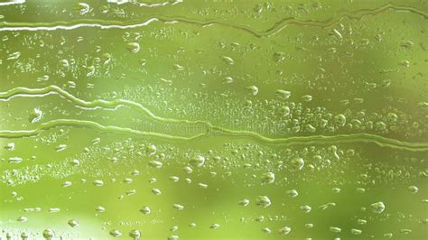 Water Rainfall Vertical Rain Drops Texture On Window Glass Blurred