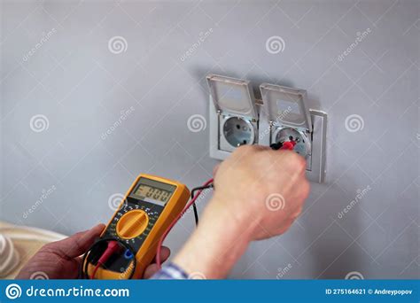 Male Electrician Checking Voltage Of Socket With Multimeter Stock Image Image Of Test Wiring