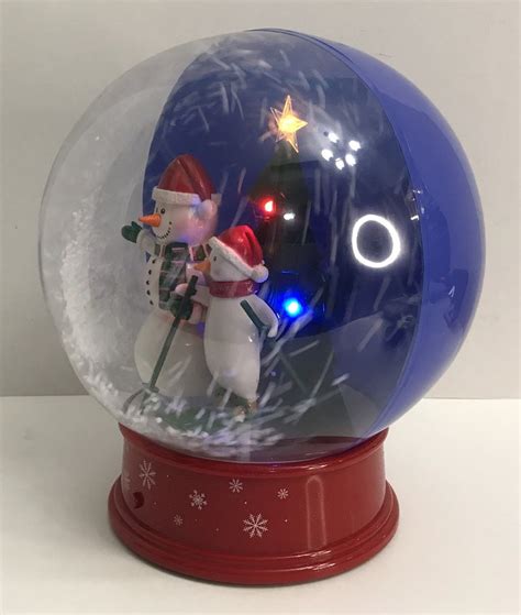Gemmy Christmas Snow Globe W Holiday Music Lights Snowman And Penguin