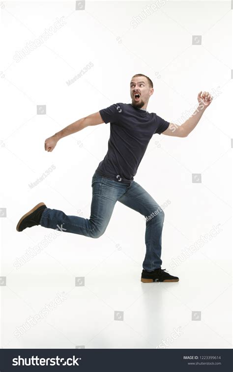 Man Running Fast White Studio Background Stock Photo Shutterstock