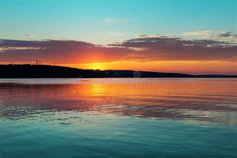 Gorgeous Orange Teal Sunset On Huge Calm Lake Stock Image Image Of