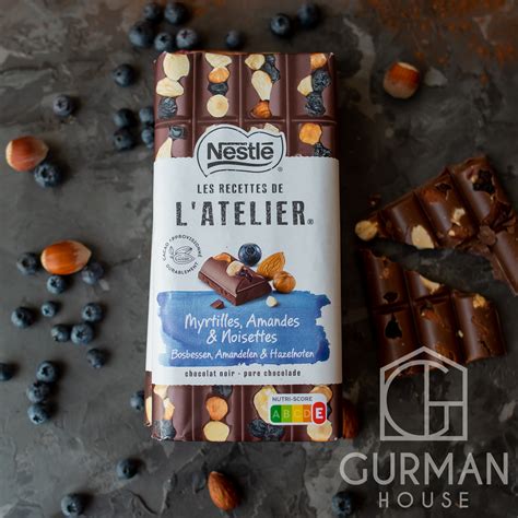Купить Крафтовый швейцарский шоколад Nestle L`atelier черный с черникой миндалем и лесным