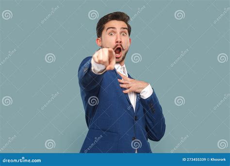 Astonished Shocked Man Standing Pointing Finger To Camera Keeps Mouth