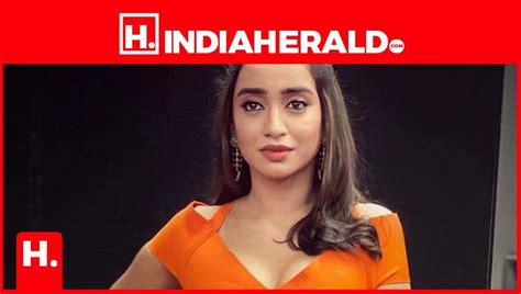 Anchor Vindhya Hot Pics In Orange Dress