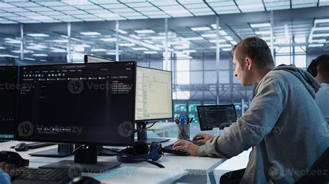 Technician Arriving At Work In High Tech Server Room Analyzing Data On Monitors Ensuring