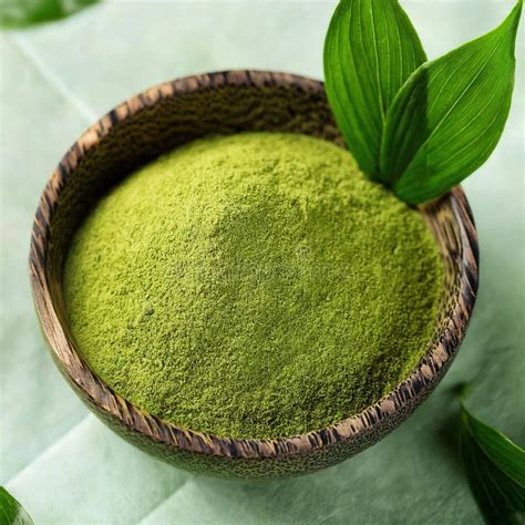 Fresh Green Matcha Tea Leaves From Japan Displayed In A Wooden Bowl