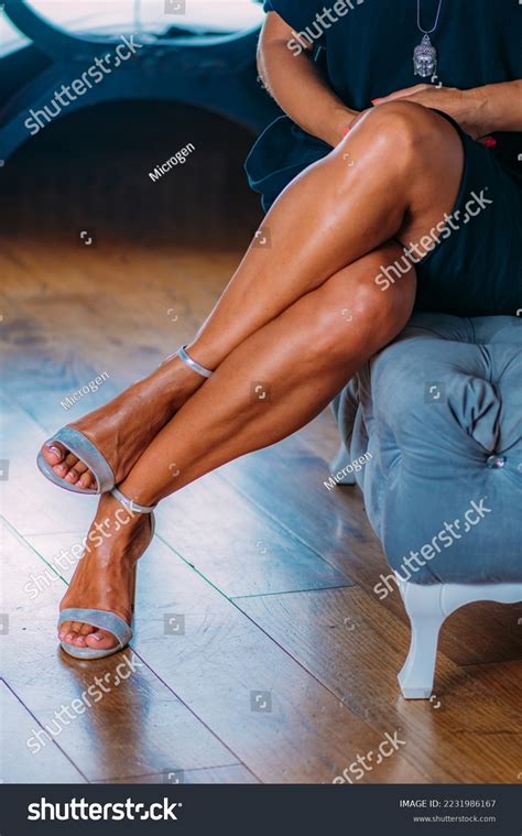 Woman Crossed Legs Wearing Silver Sandals Stock Photo Shutterstock