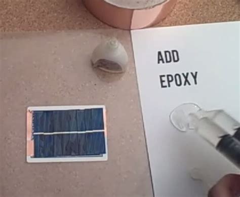 Solar Powered Arduino On The Back Of A Playing Card