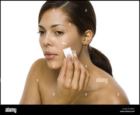 Woman Applying Foundation With Makeup Sponge Stock Photo Alamy