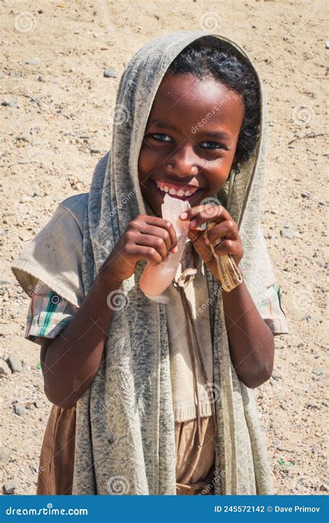 Nice And Cute Young Girl Smiling And Eating Sweets Editorial