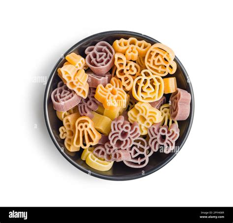 Pasta Of Various Scary Shapes Uncooked Halloween Pasta In Bowl Isolated On White Background