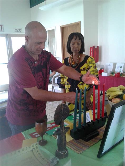 African Retired Principal Sandra Shawhan Looks On As Paulo Lights The