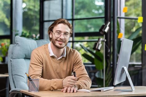 Premium Photo Portrait Of Successful Smiling Programmer Inside Modern Green Loft Office Blond