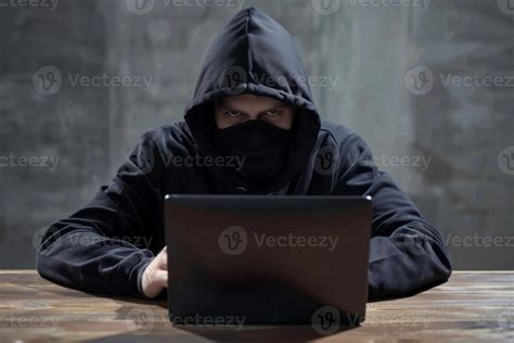 Hacker In Hood Hacking At Computer In Dark Room Computer Criminal Uses