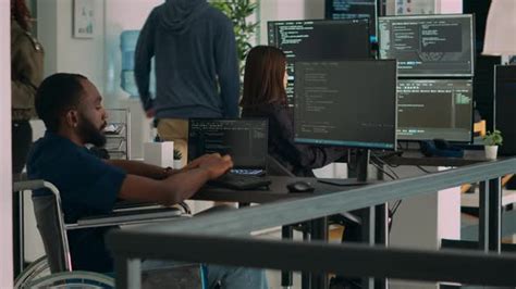 software developer wheelchair user working on html script code