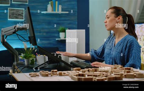 Woman Working As Architect Analyzing Virtual Maquette On Monitor With Touch Screen Engineer