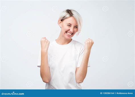 Excited Cheerful Teenager Girl Model With Joyful Expression Cheers And