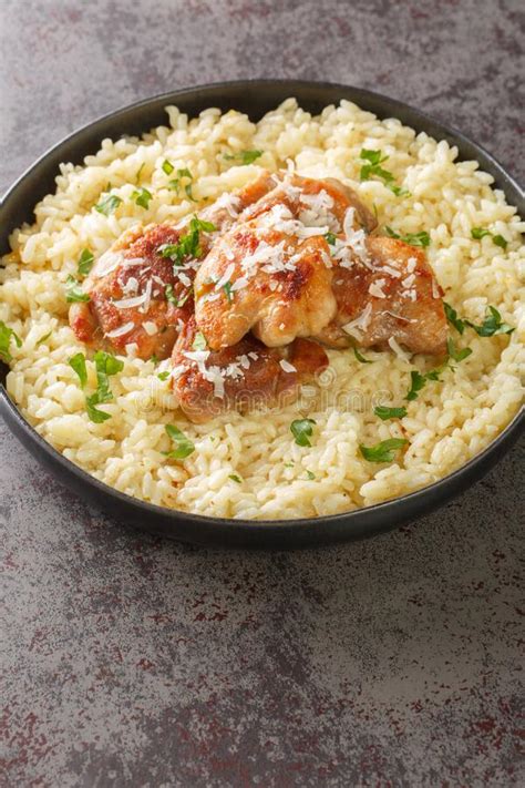 Creamy Parmesan Risotto Served With Fried Chicken Close Up In A Plate