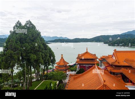 Aerial Shot Of Wen Wu Temple Roofs In Background Of Sun Moon Lake And