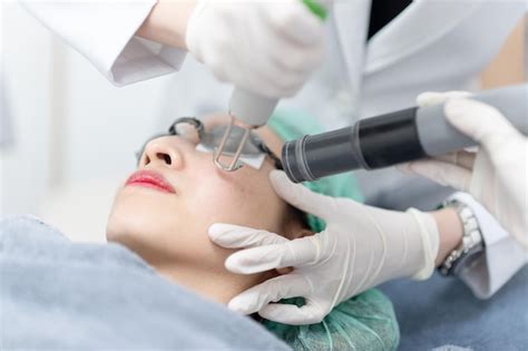 Premium Photo Woman Receiving Pico Laser Facial Treatment In Beauty Clinic