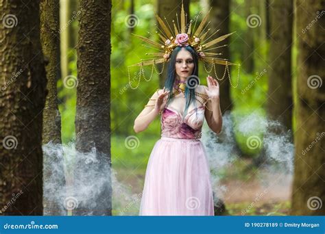 Costume Play Concepts And Sensual Crowned Forest Nymph With Flowery Golden Crown Posing In
