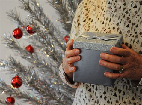 Woman Holding Silver Gift Free Stock Photo - Public Domain Pictures
