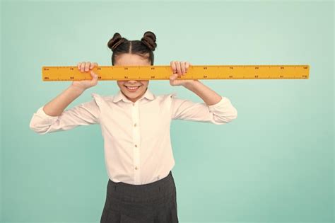 Premium Photo Back To Babe Babe Girl Hold Ruler Measuring Isolated On Blue Background