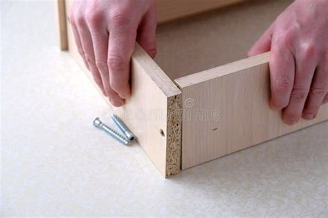 Assembling A Furniture Box Male Hand Holding A Stock Image Image Of
