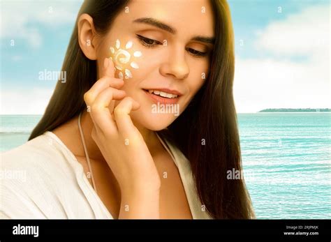 Sun Protection Beautiful Young Woman Applying Sunblock Onto Face On