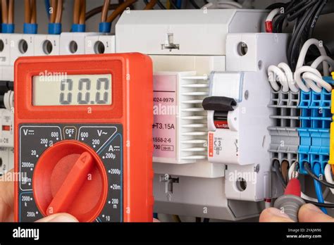 Electrician Testing Voltage With Multimeter In Panel Stock Photo Alamy