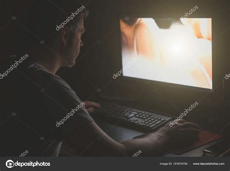 Man Watching Erotic Movie On Computer At Night Stock Photo Mproduction 191674754