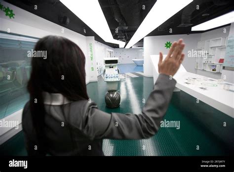 A Woman Commands A Robot At Fusion World A Showcase For Futuristic