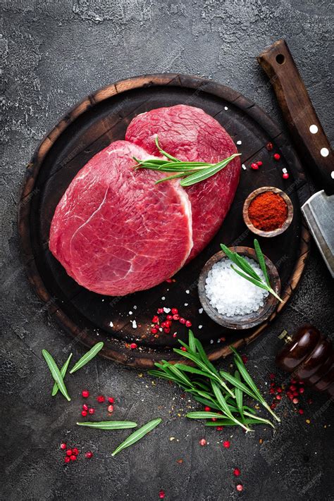 Premium Photo Raw Beef Meat Fresh Cut Of Beef Meat On Board With Spices