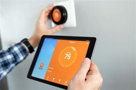 Premium Photo Man Is Adjusting A Temperature Using A Tablet With Smart Home App In Modern