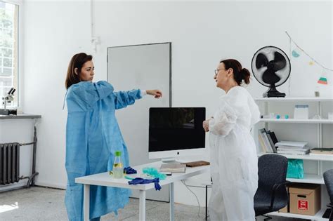 Premium Photo Two Women In A Room With A Monitor And A Monitor