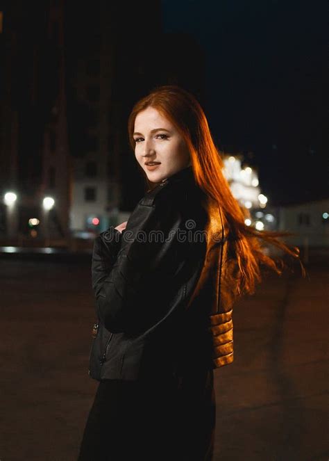 Mysterious Redhead Woman In Elegant Leather Jacket Coat And High Heels