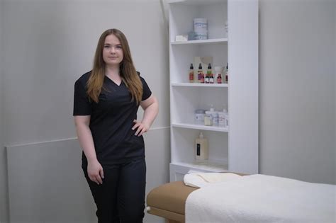 Premium Photo Portrait Of Smiling Beauty Therapist Standing Massage