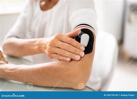 Woman Testing Glucose Level With A Continuous Glucose Monitor Stock Image Image Of Continuous