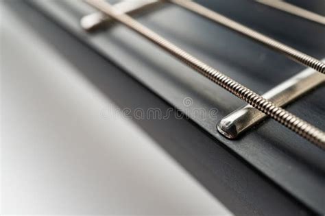 Close Up Of An Electric Guitar With Pristine Copper Strings And