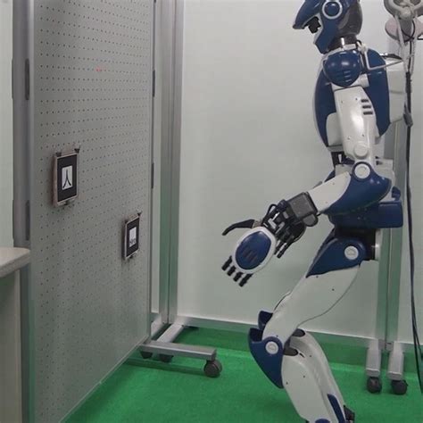 human left and humanoid robot right perform a manipulation task