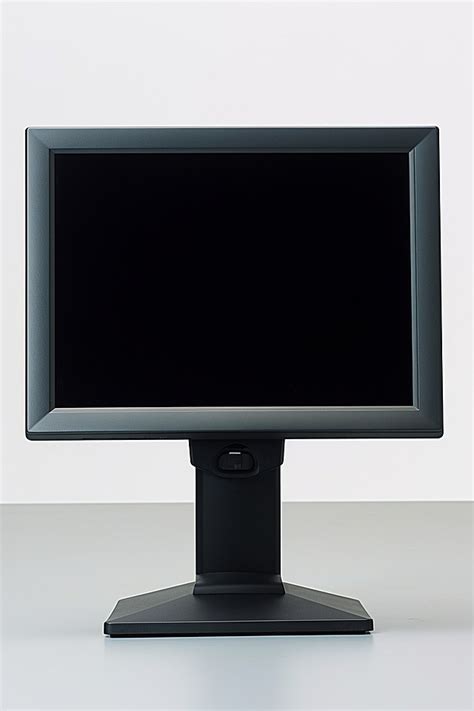 A Black Monitor Is On Stand And Facing The Camera Background Wallpaper Image For Free Download