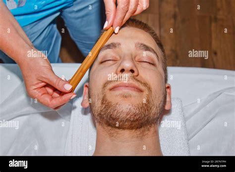 Wellness Concept Professional Masseur Gives A Man A Thai Facial