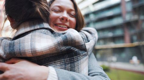 Two Happy Women Hug Each Other When Meeting After Long Separation