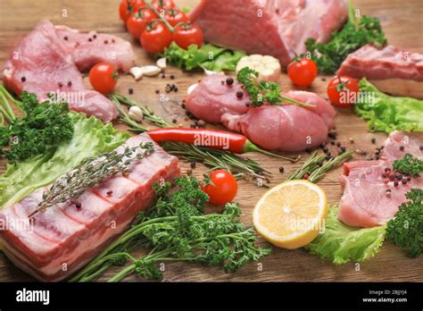 Different Types Of Meat On Wooden Table Stock Photo Alamy