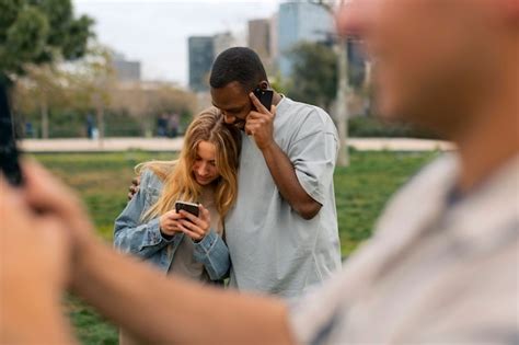 Free Photo Group Of Friends Reading Cell Phone Messages