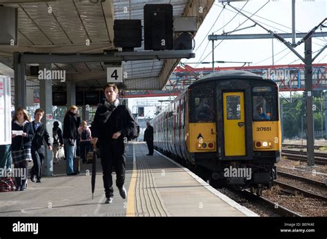 Class 317 Train And Passengers At Cambridge Railway Station England