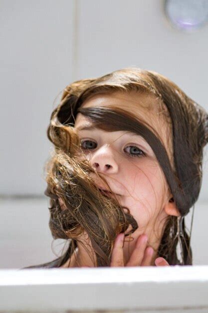 Premium Photo Close Up Portrait Of Playful Girl In Bathroom